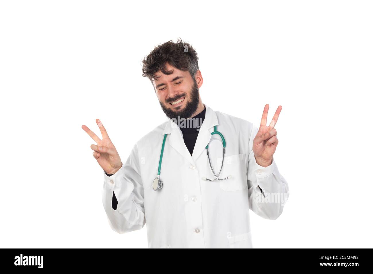 Young doctor with beard wearing a medical gown isolated on a white ...