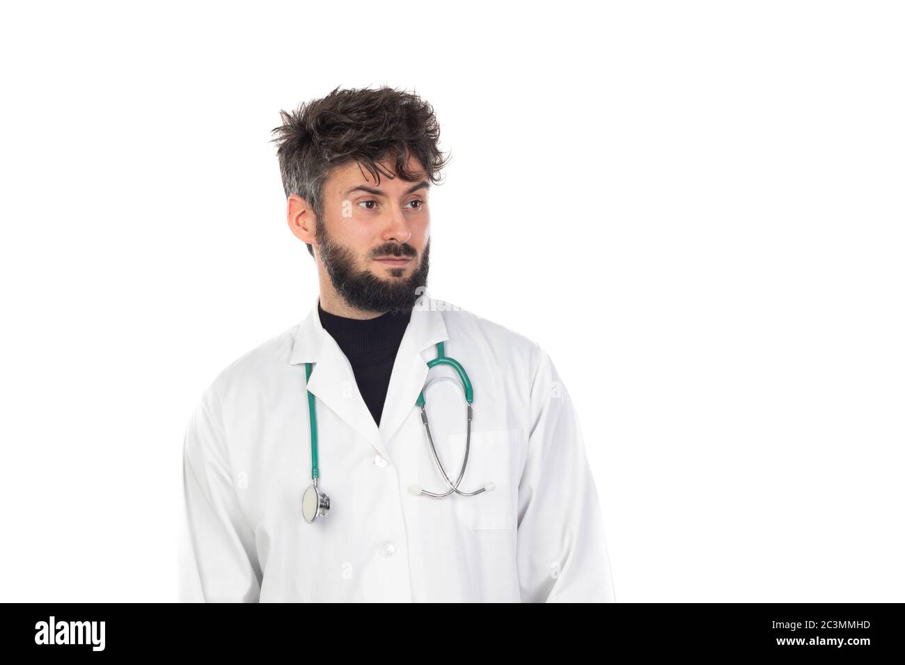 Young doctor with beard wearing a medical gown isolated on a white ...