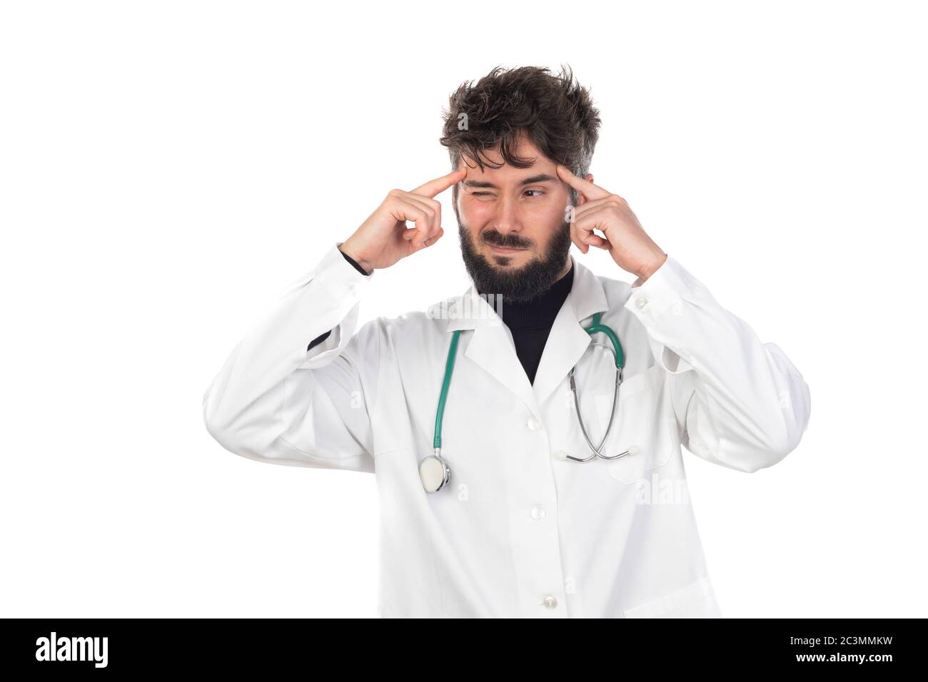 Young doctor with beard wearing a medical gown isolated on a white ...