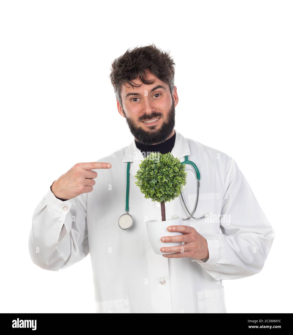 Young doctor with beard wearing a medical gown isolated on a white ...