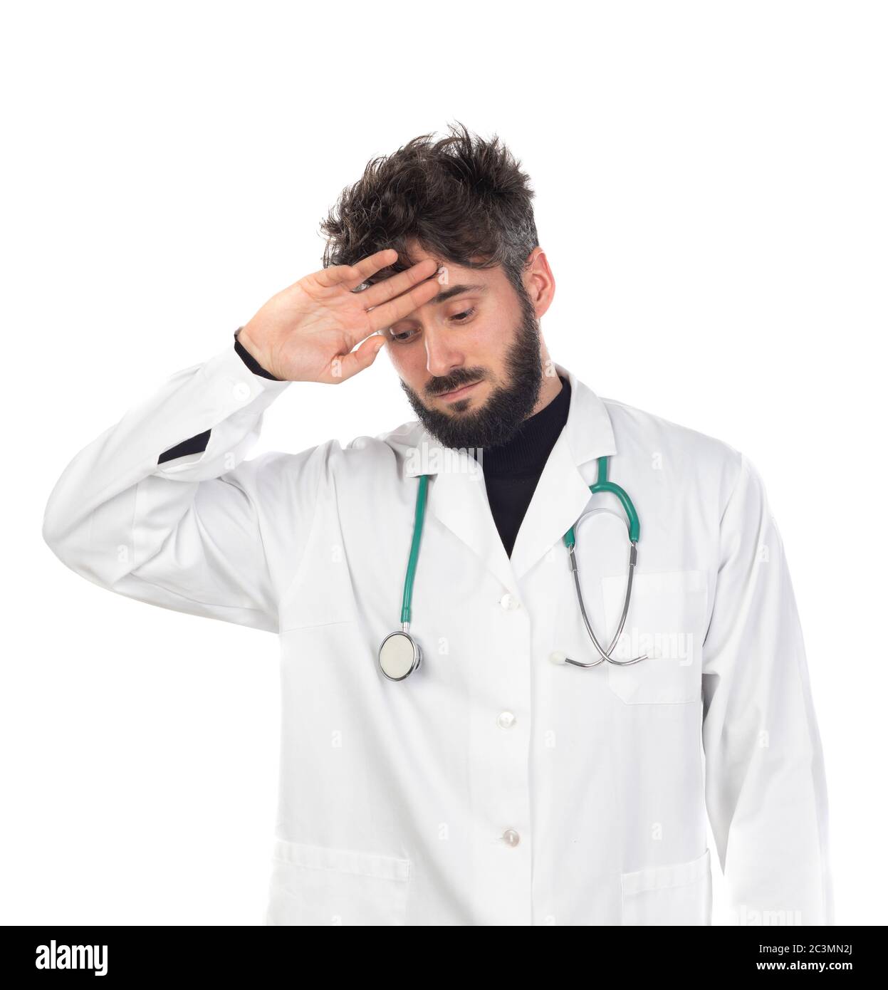 Young doctor with beard wearing a medical gown isolated on a white ...
