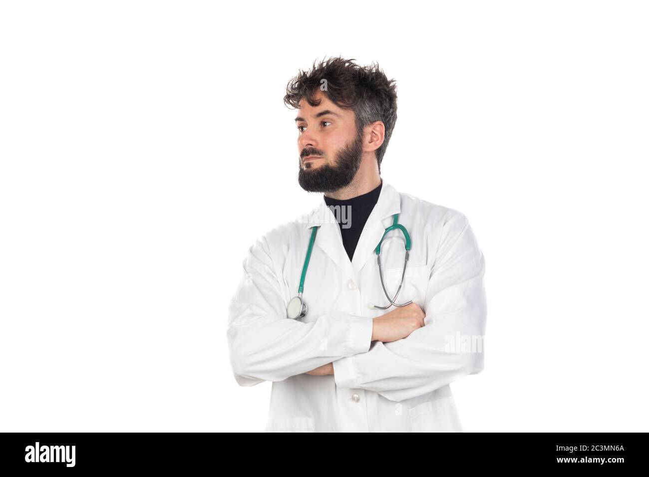 Young doctor with beard wearing a medical gown isolated on a white ...