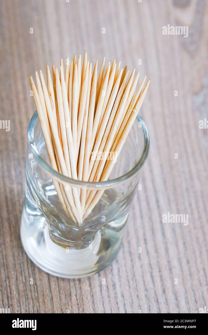 Wooden toothpicks placed in a glass container Stock Photo - Alamy