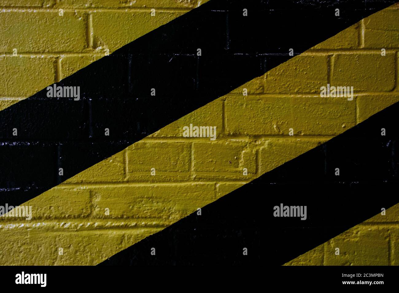 Shot of a yellow and black colored brick wall - great for wallpapers ...