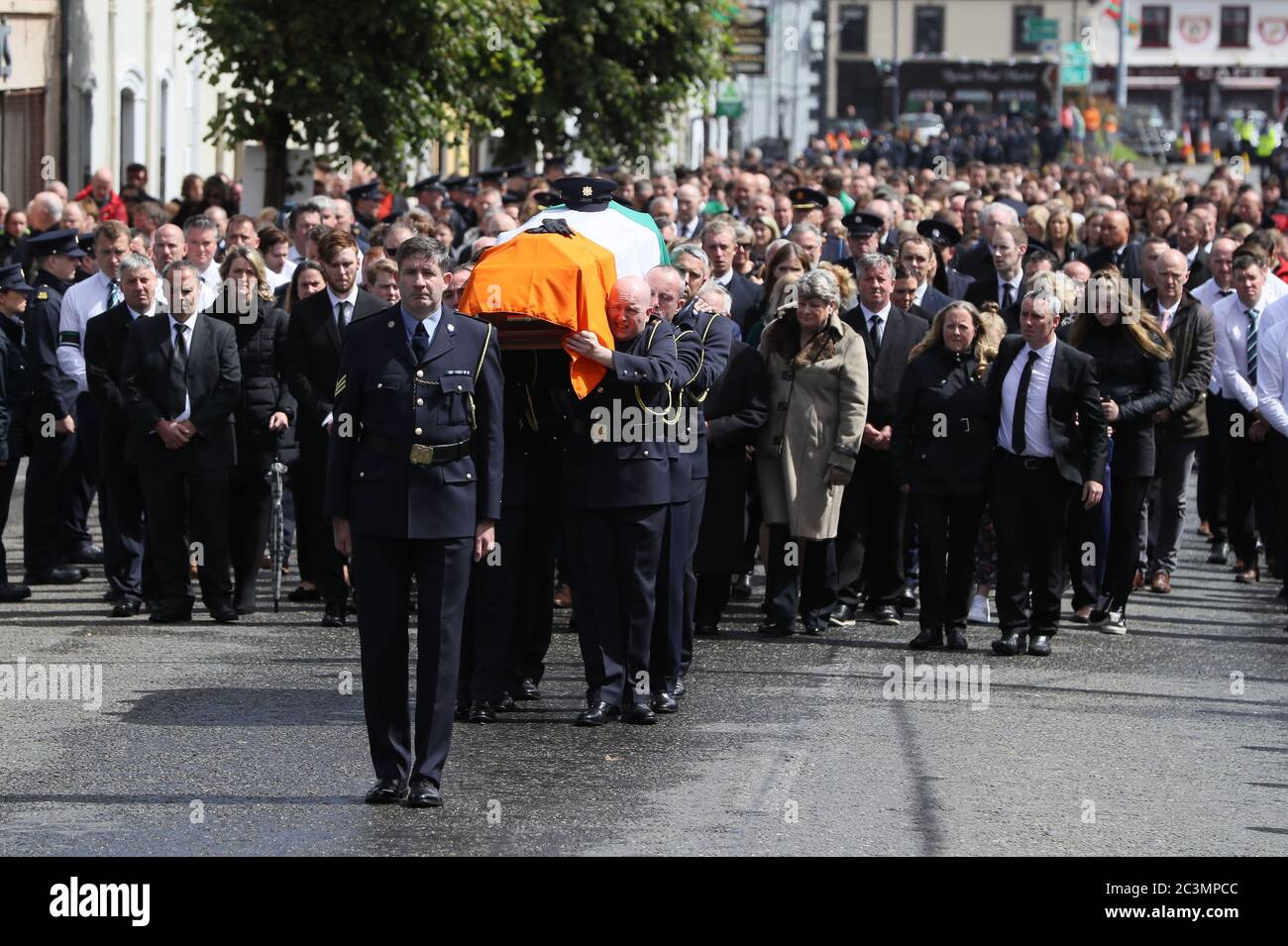 The coffin of Detective Garda Colm Horkan is carried to St James ...