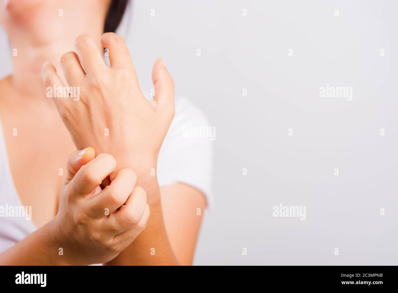 Asian beautiful woman itching her useing hand scratch itch hand on ...