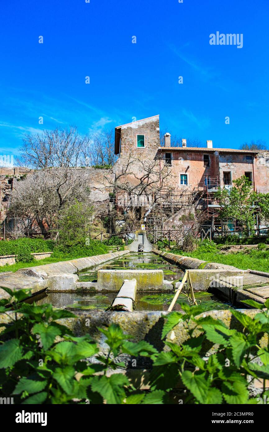 a farm with a watering hole for animals, inside the Caffarella park ...