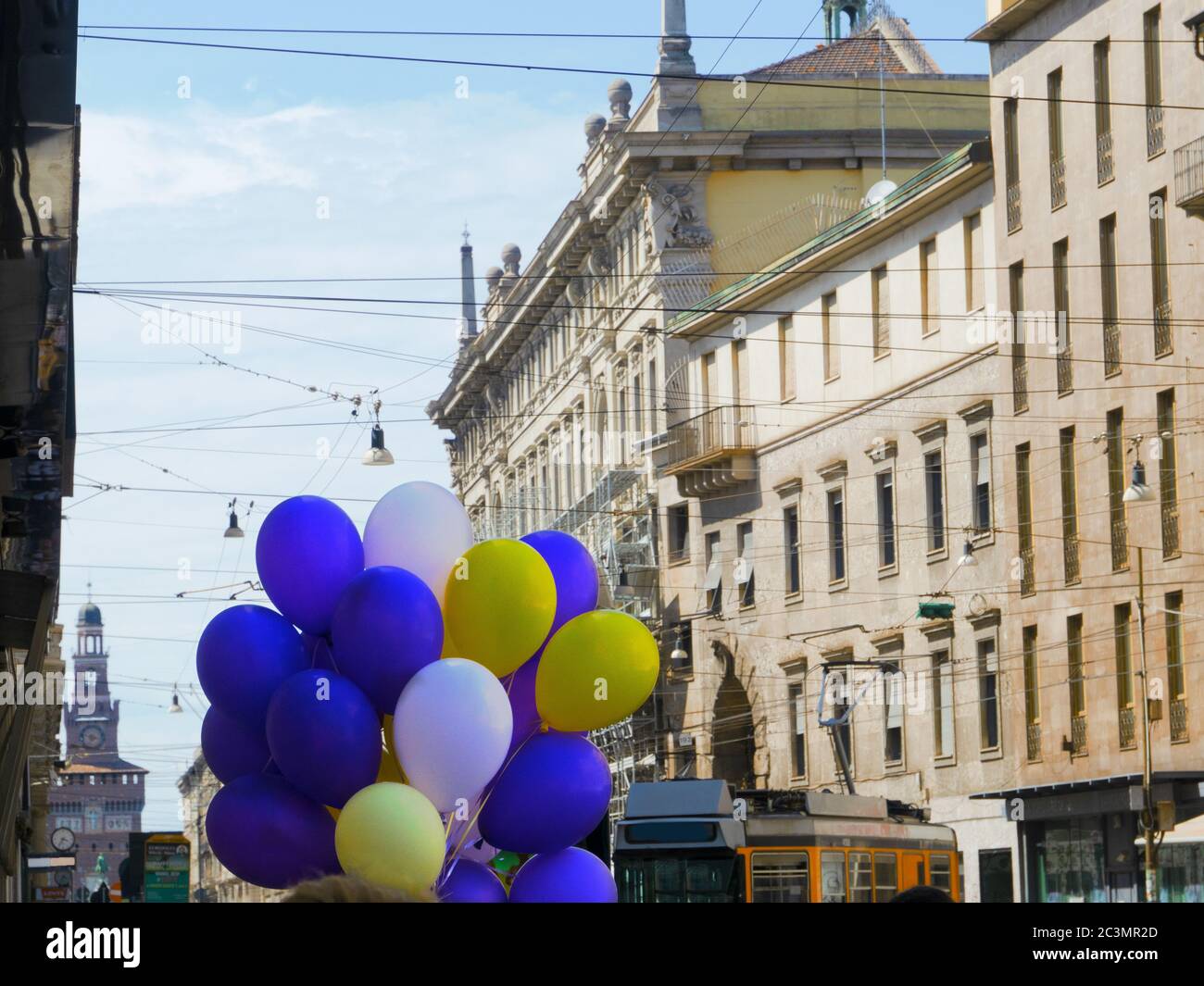 colorful balloons between the buildings in the center of Milan, Italy ...
