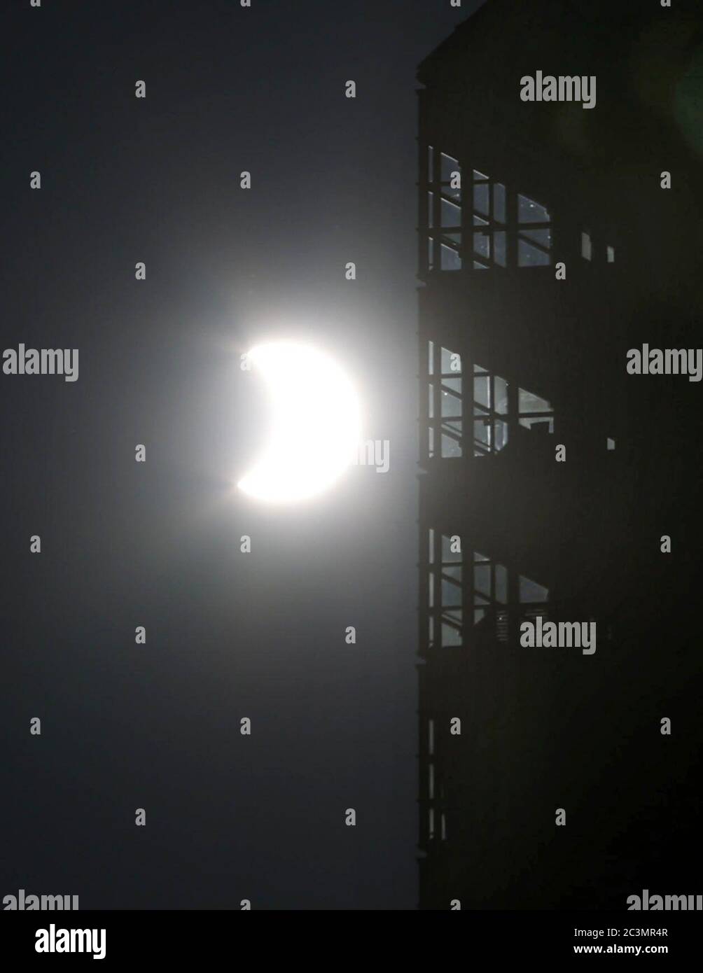 Photo shows a partial solar eclipse seen near Fukuoka Tower in ...