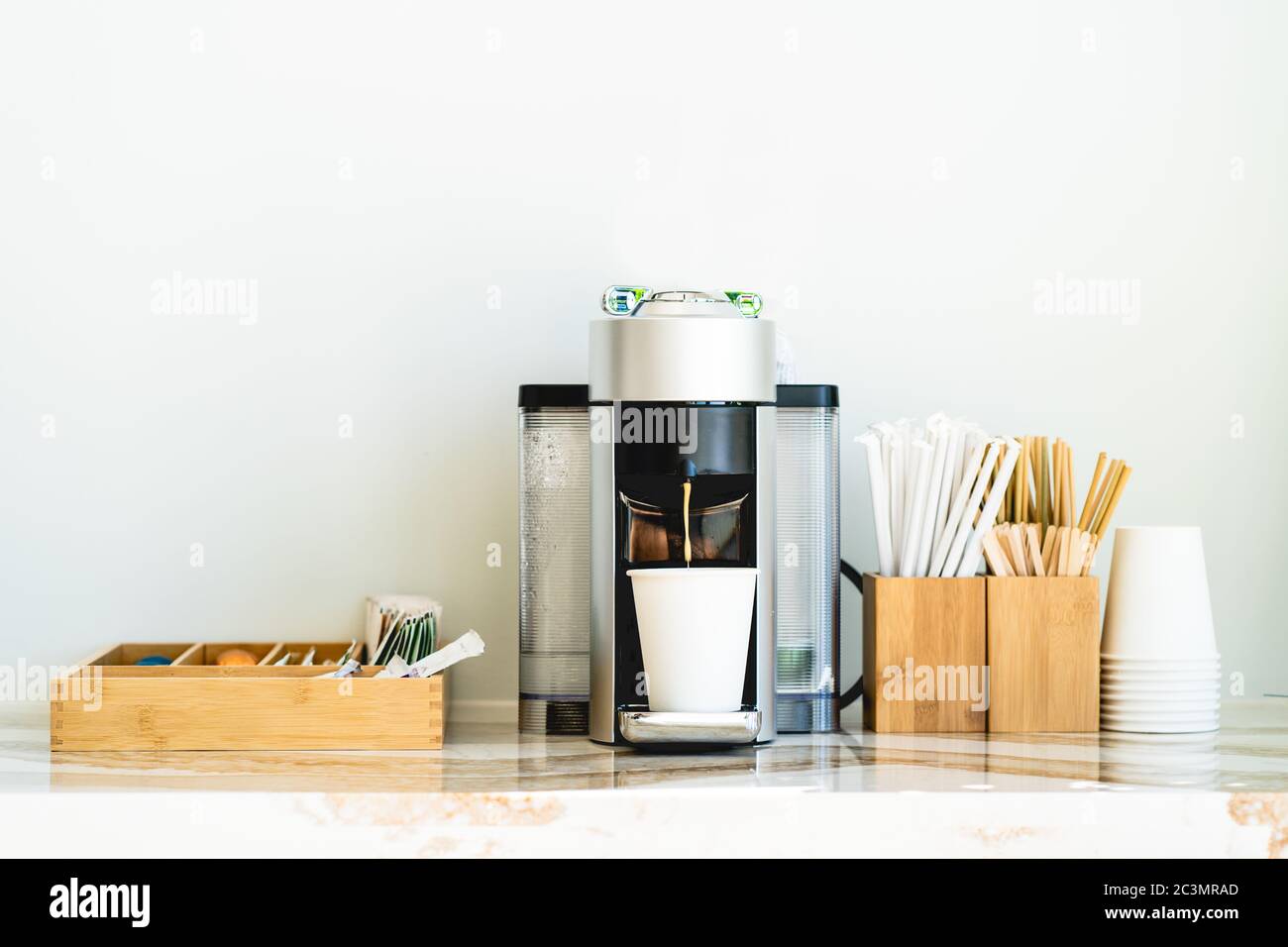 Juice extractor surrounded by kitchen utensils Stock Photo - Alamy