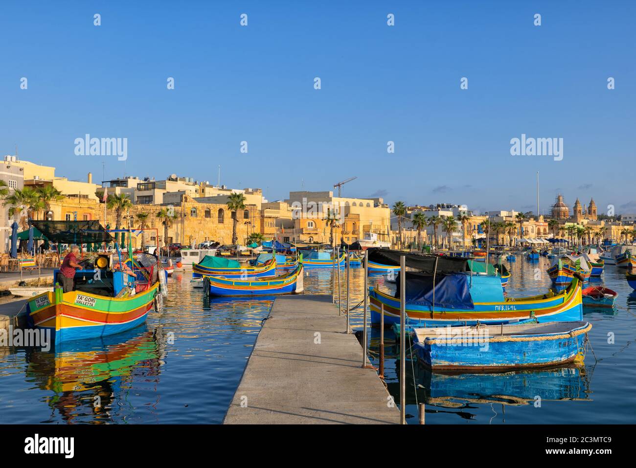 Marsaxlokk fishing village port in Malta, Traditional Maltese Luzzu ...