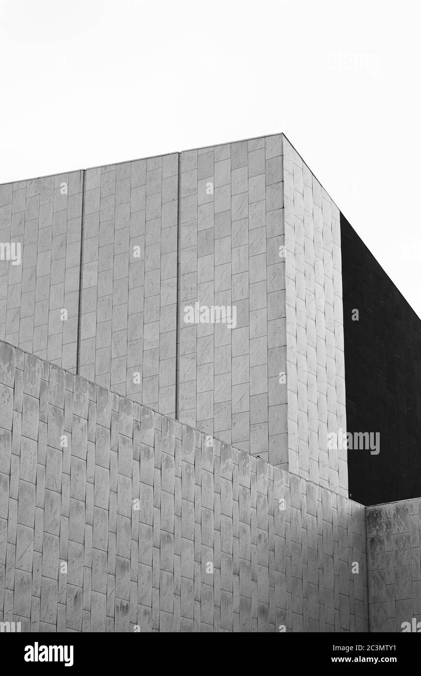 Grayscale shot of the facade of a modern building made of concrete ...