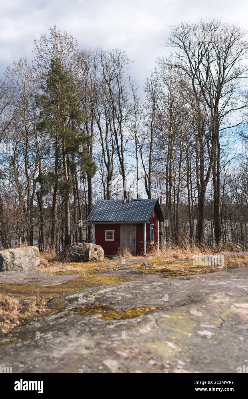 Red shack with bare trees in the background Stock Photo - Alamy