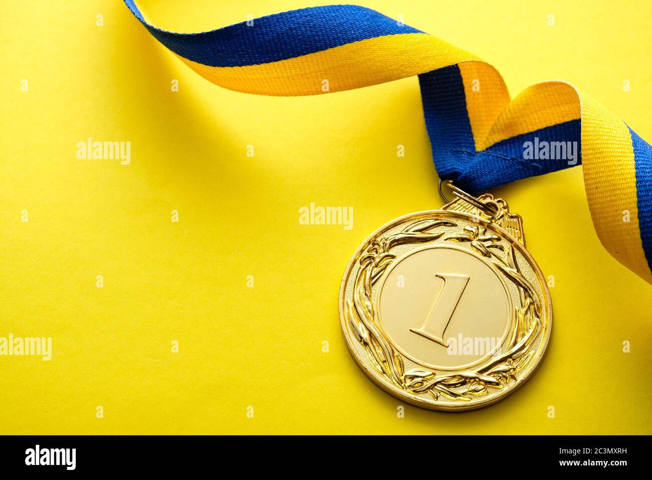 Gold medallion for the winner or champion in a competition or race on a ...