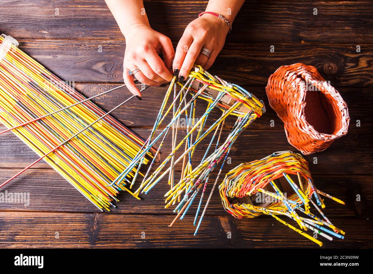 Top view of the process of weaving from paper Stock Photo - Alamy
