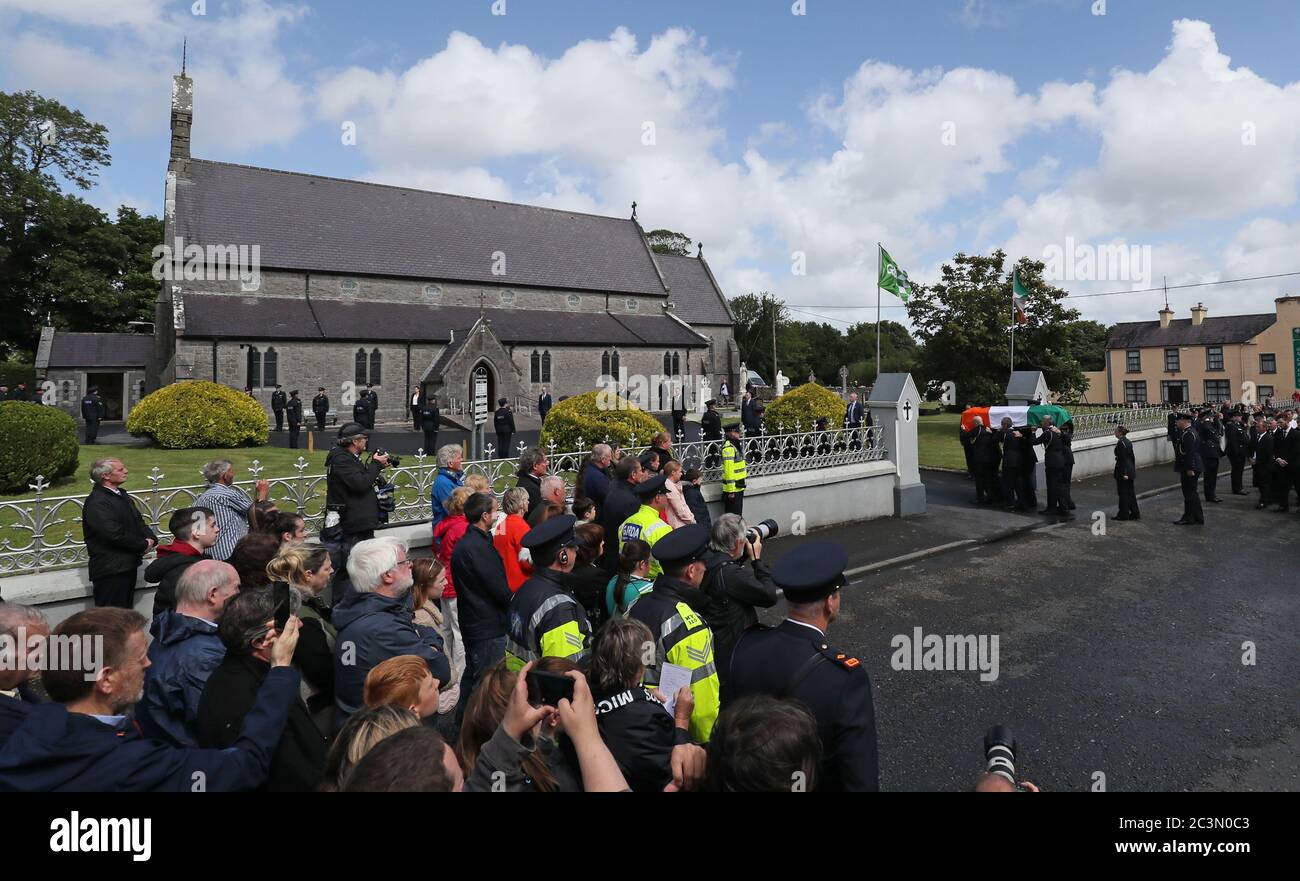 The coffin of Detective Garda Colm Horkan is carried into St James ...