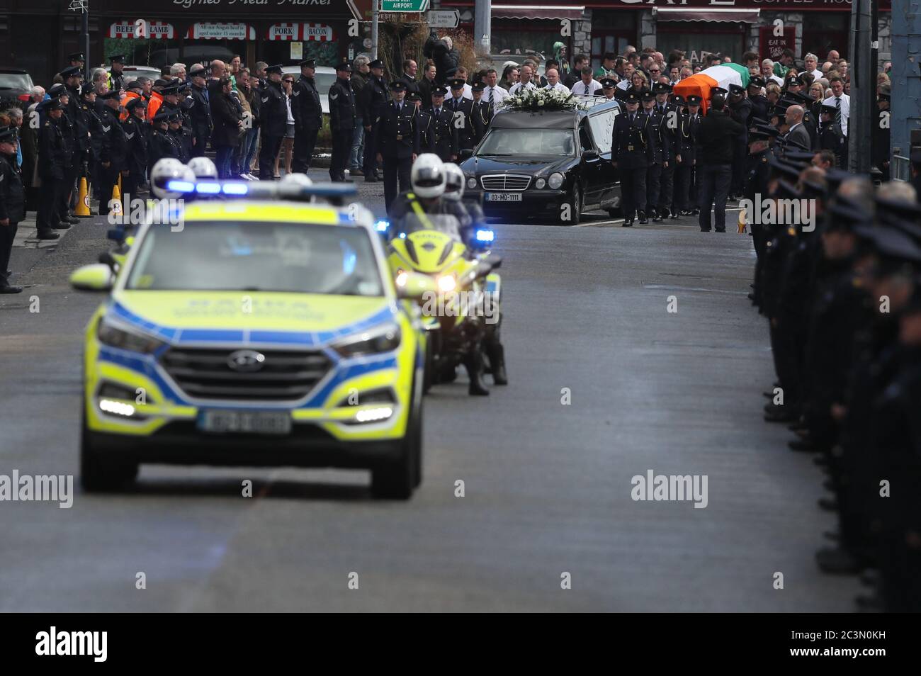 The coffin of Detective Garda Colm Horkan is carried to St James ...