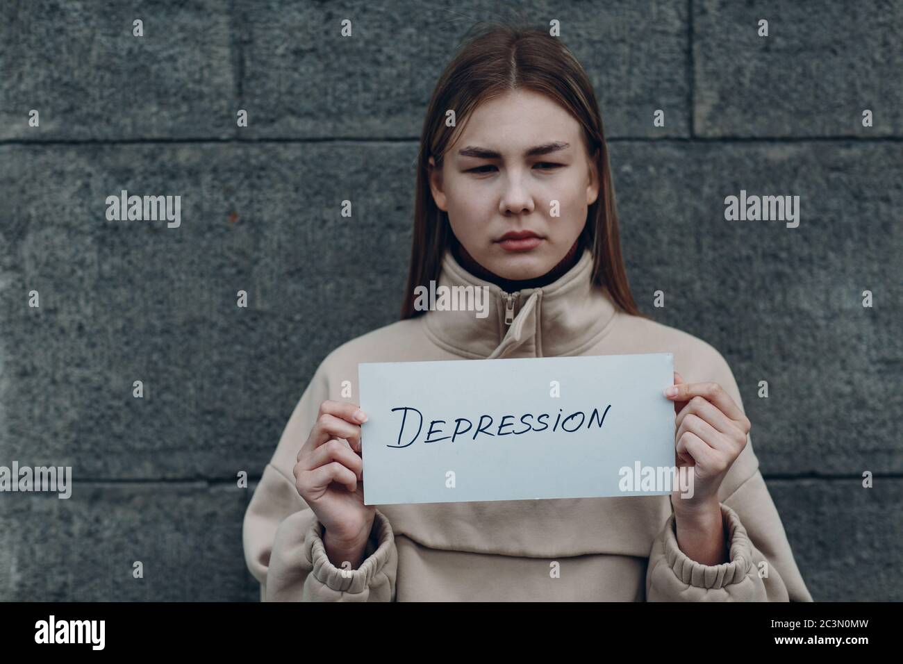 Young female holds in hand sheet of paper with word Depression Stock ...