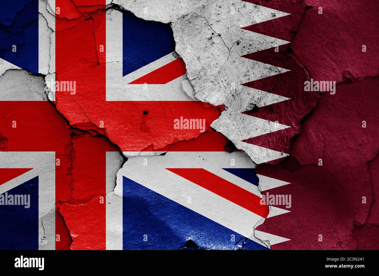 flags of UK and Qatar painted on cracked wall Stock Photo - Alamy