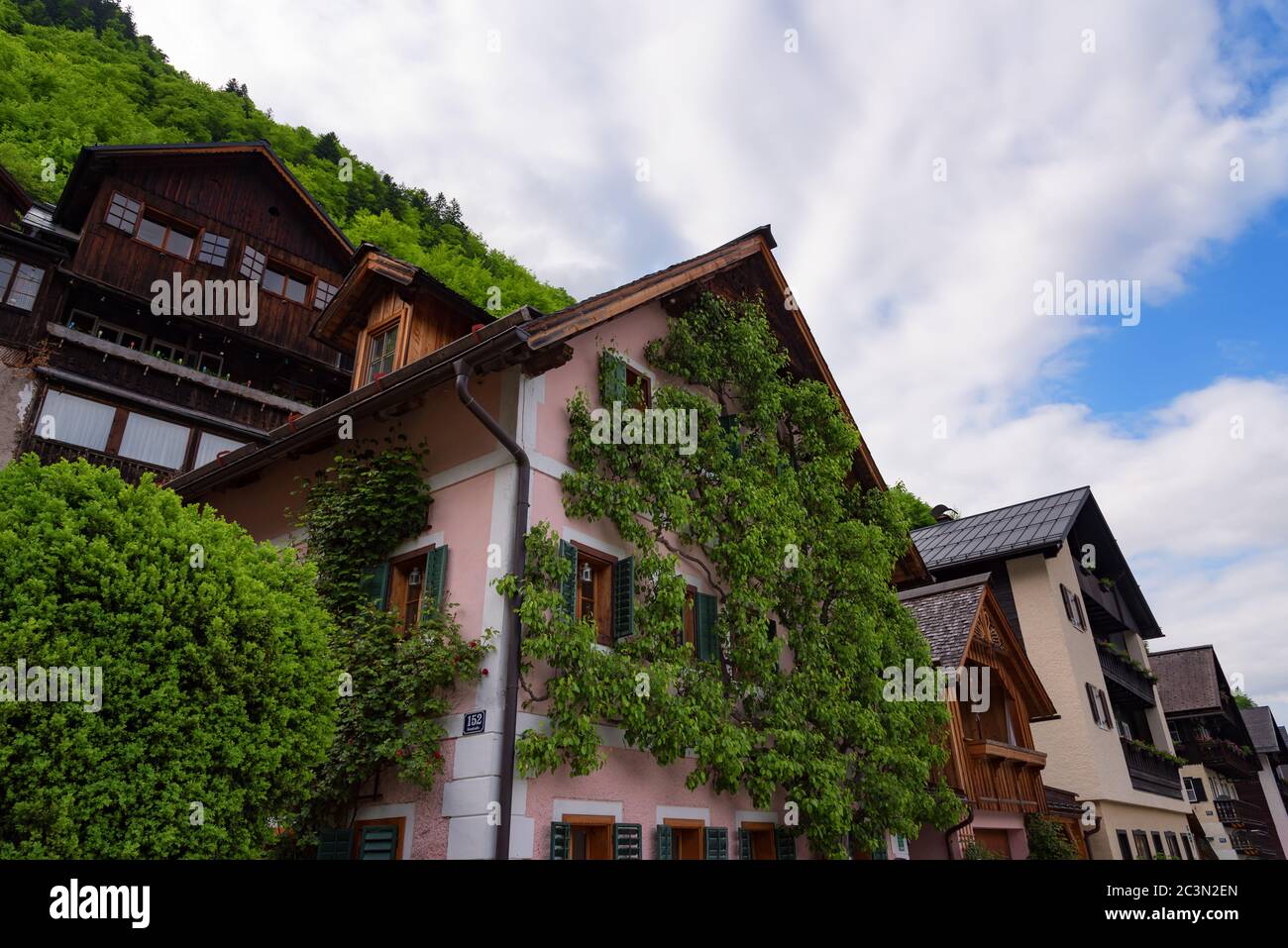 Typical Austrian Alpine houses with bright flowers, Hallstatt, Austria ...