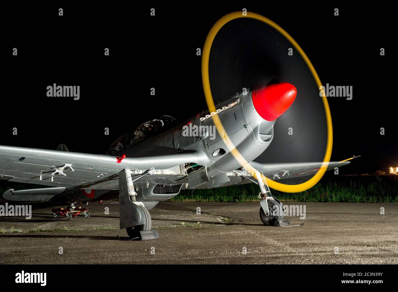 Aircraft with its propeller spinning fast at night Stock Photo - Alamy
