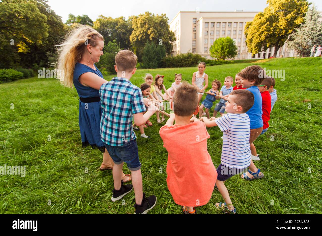 Kids make geometric shapes using a rope Stock Photo - Alamy
