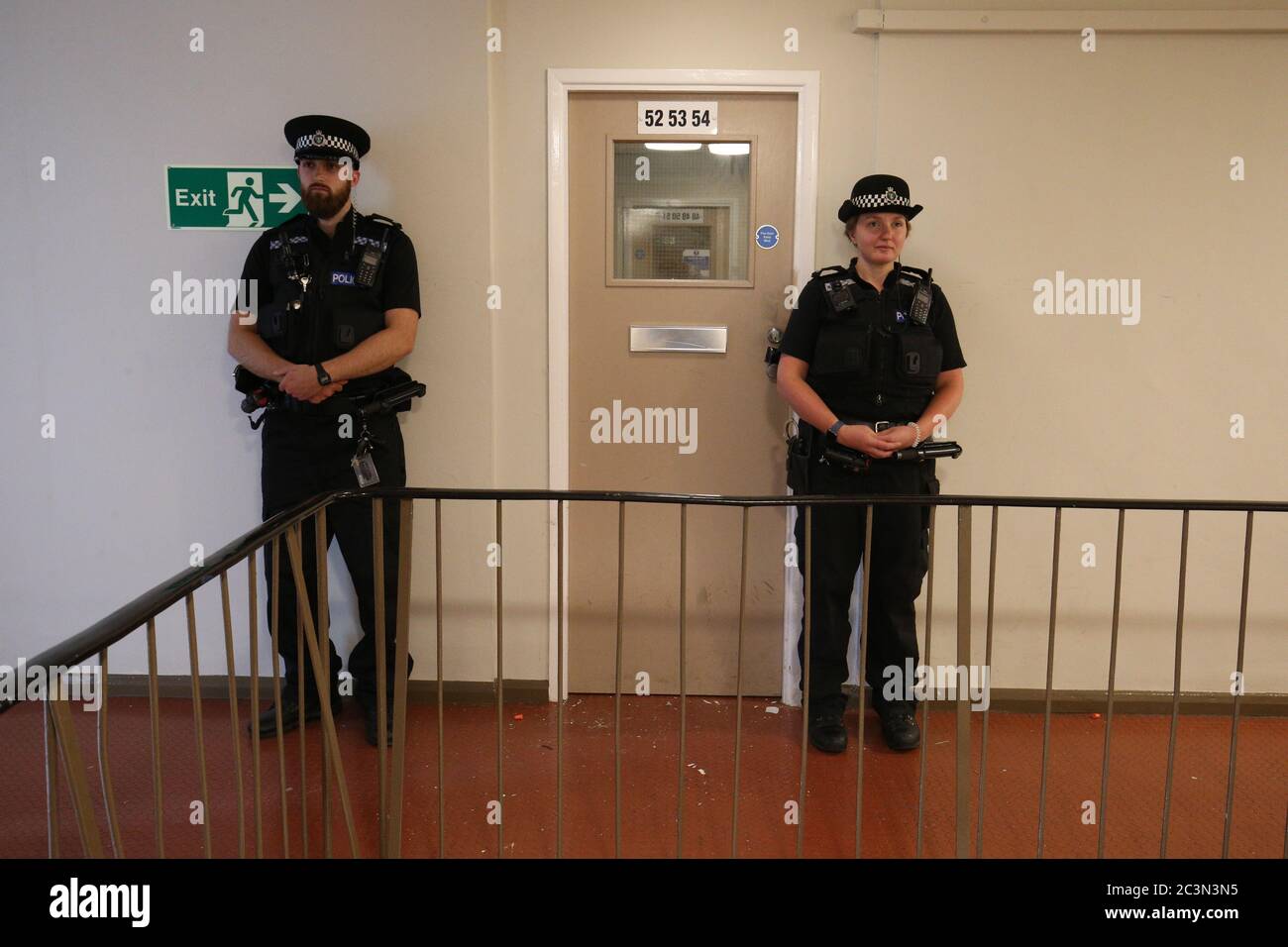 Police officers standing guard outside corridor hi-res stock ...