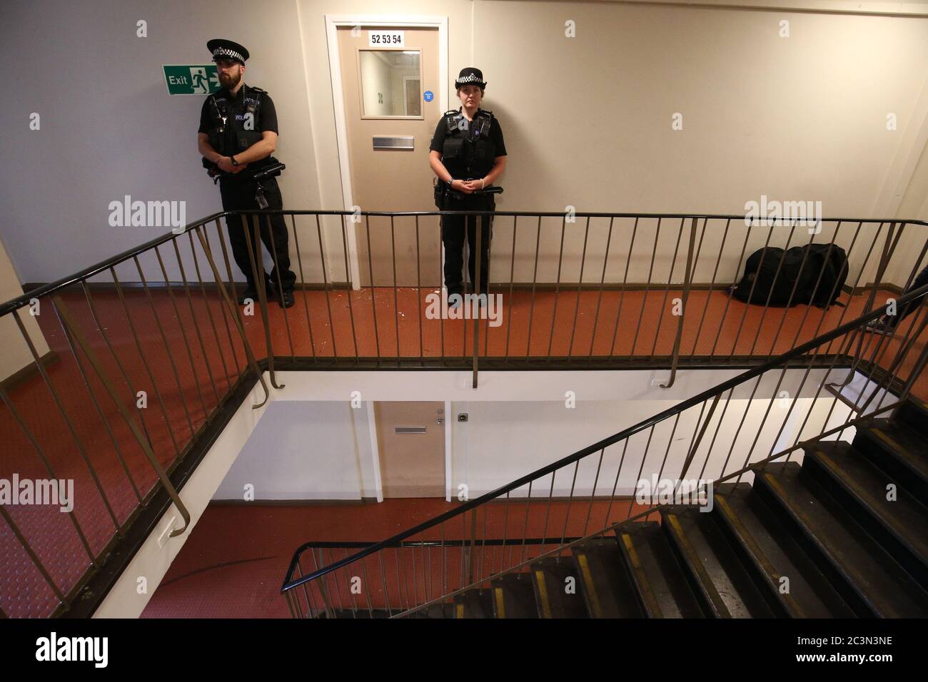 Police officers standing guard outside corridor hi-res stock ...