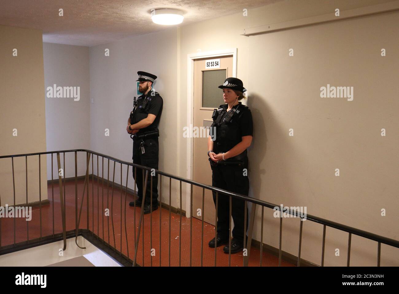 Police officers standing guard outside corridor hi-res stock ...