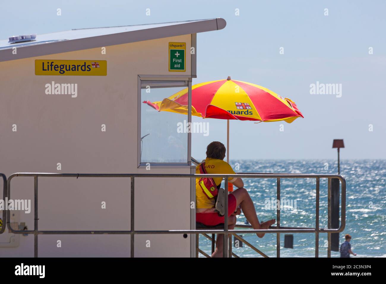 Lifeguard keeping a lookout lifeguard keeping a look out hi-res stock ...