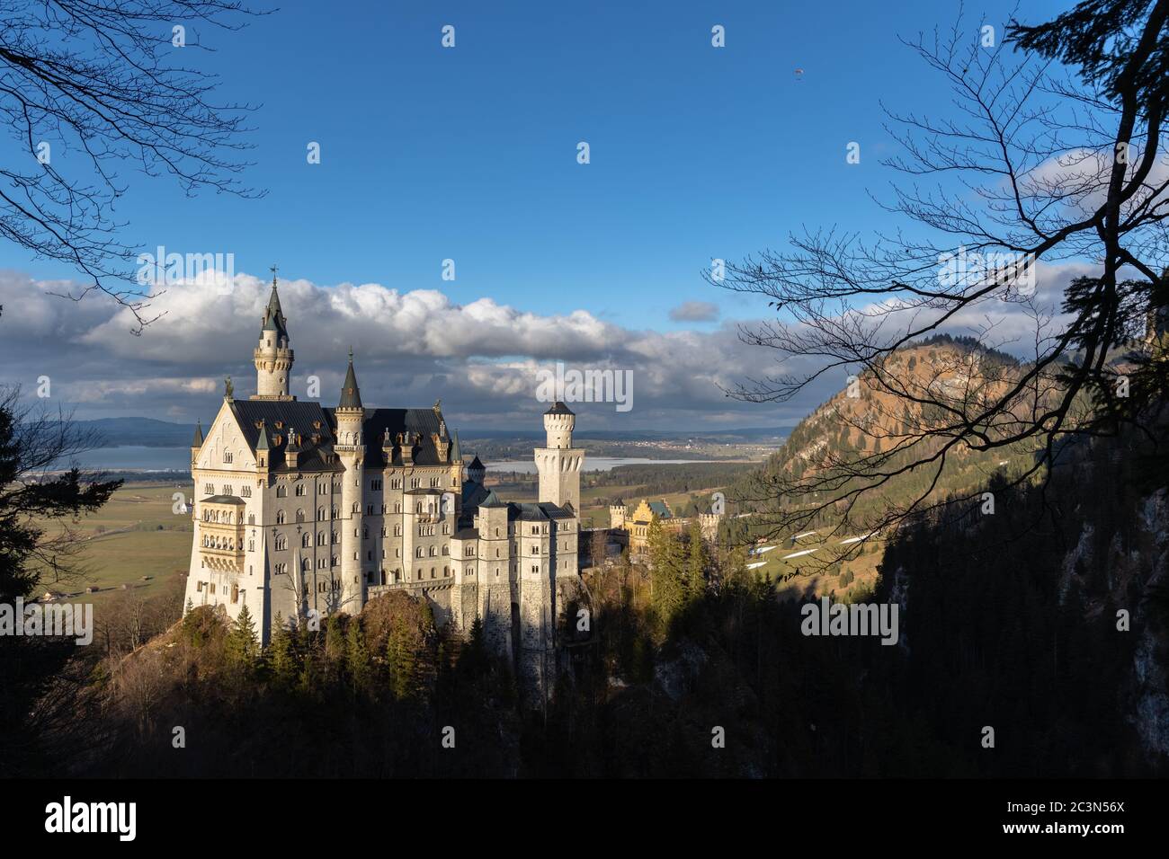 Panorama view of the famous Neuschwanstein Castle at sunset in winter ...