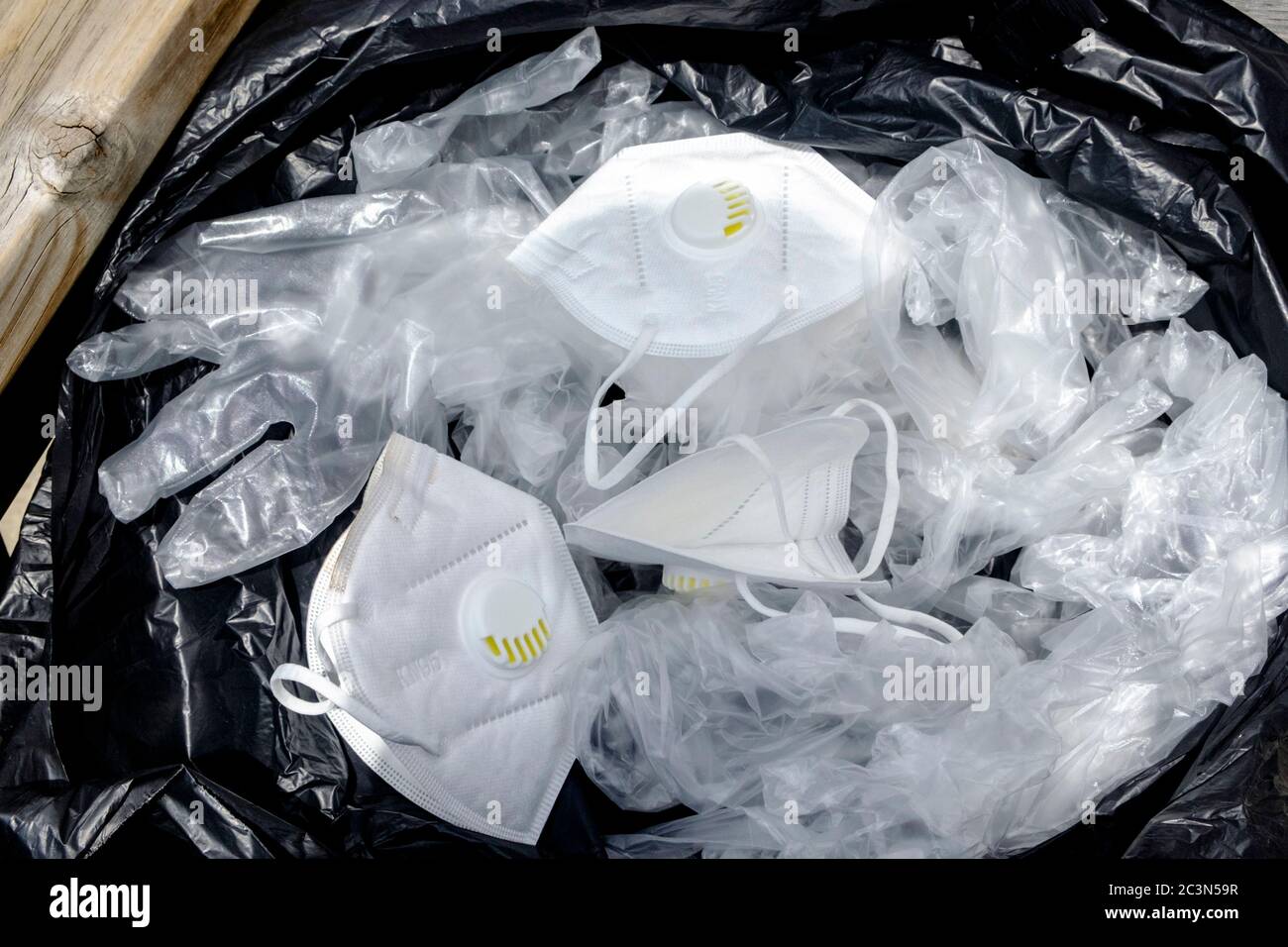 Disposable gloves and face masks in a Black Bin Bag Stock Photo - Alamy