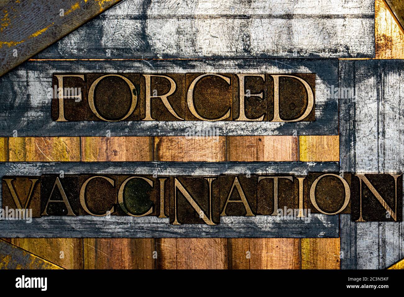 Forced Vaccination text formed with real authentic typeset letters on ...