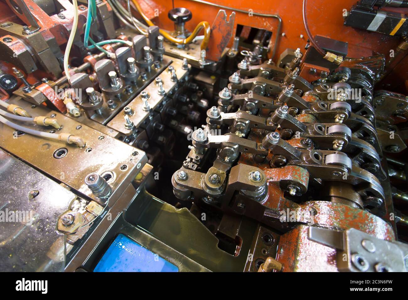 Detail of industrial machinery inside a production line facility plant ...