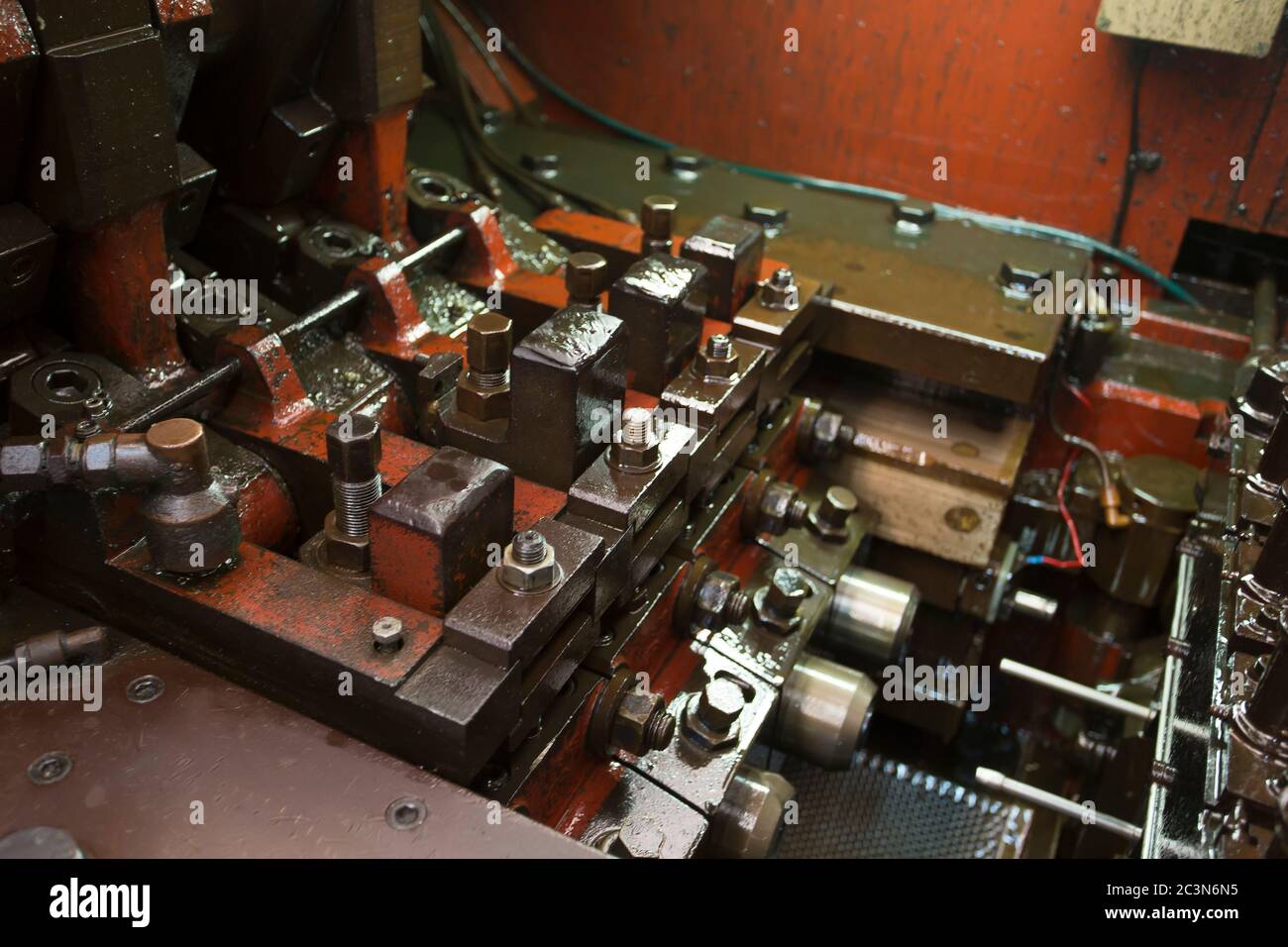 Detail of industrial machinery inside a production line facility plant ...