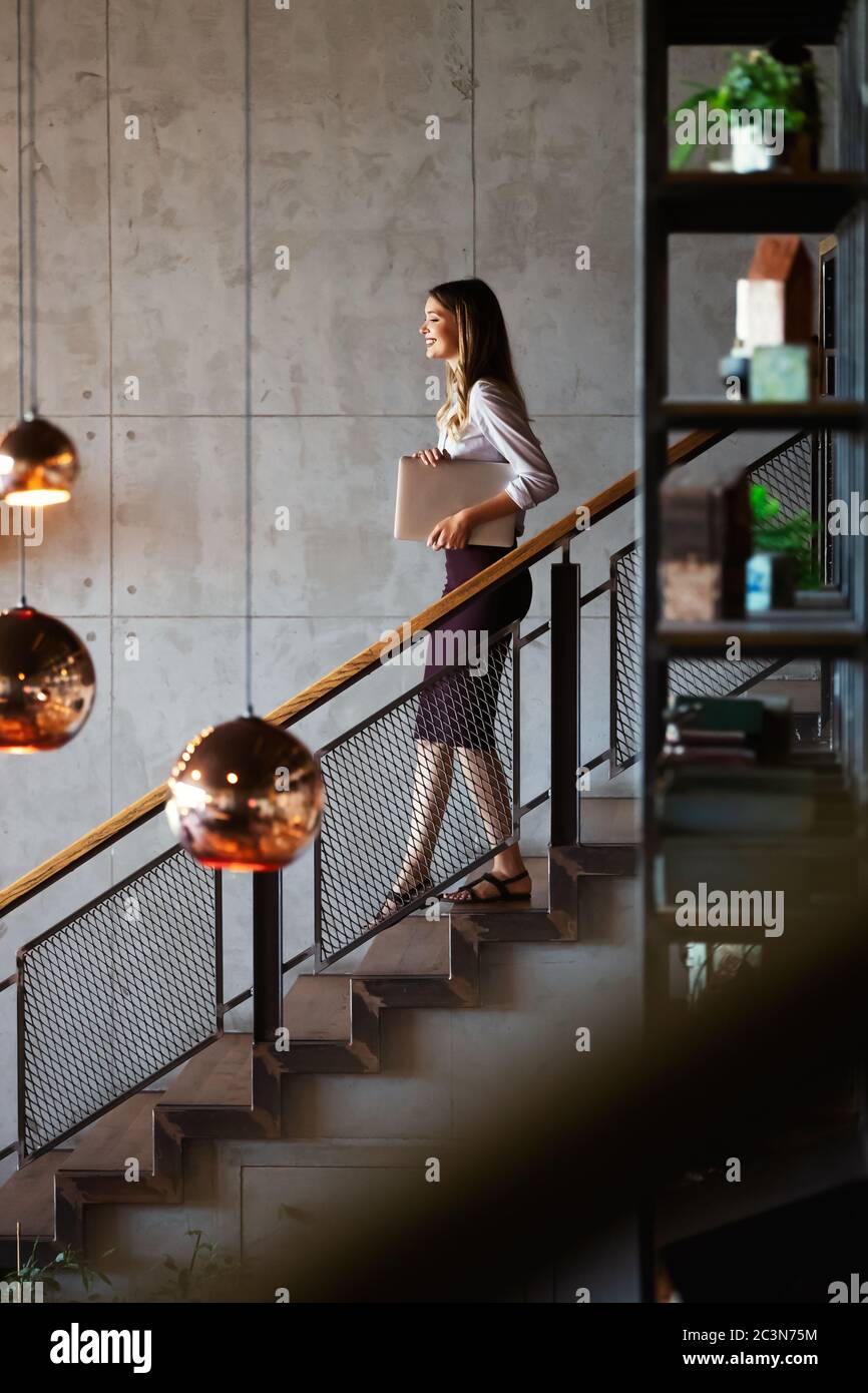 Beautiful executive business woman, ceo, coworker at the workspace ...