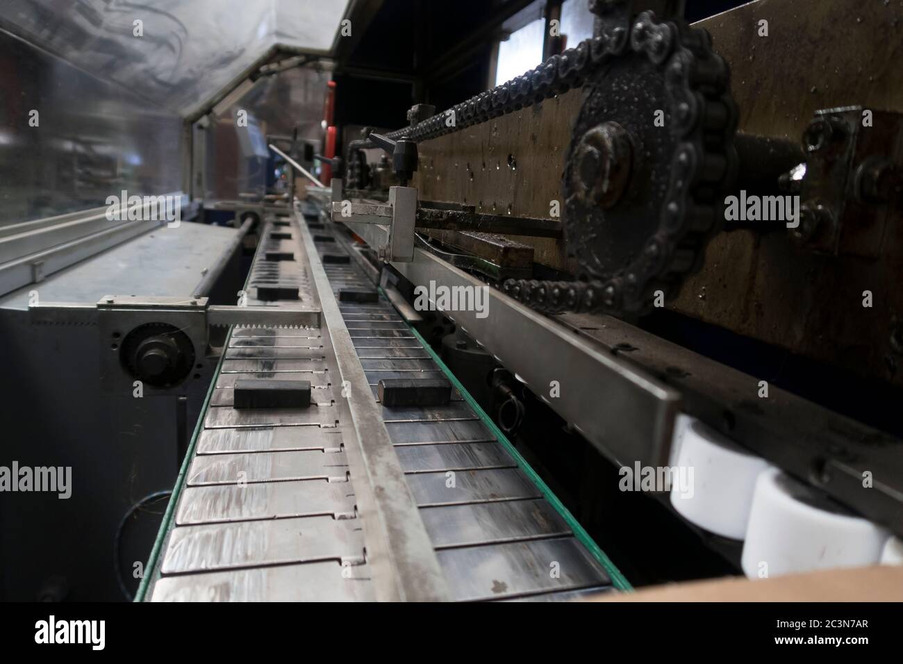 Detail of industrial machinery inside a production line facility plant ...