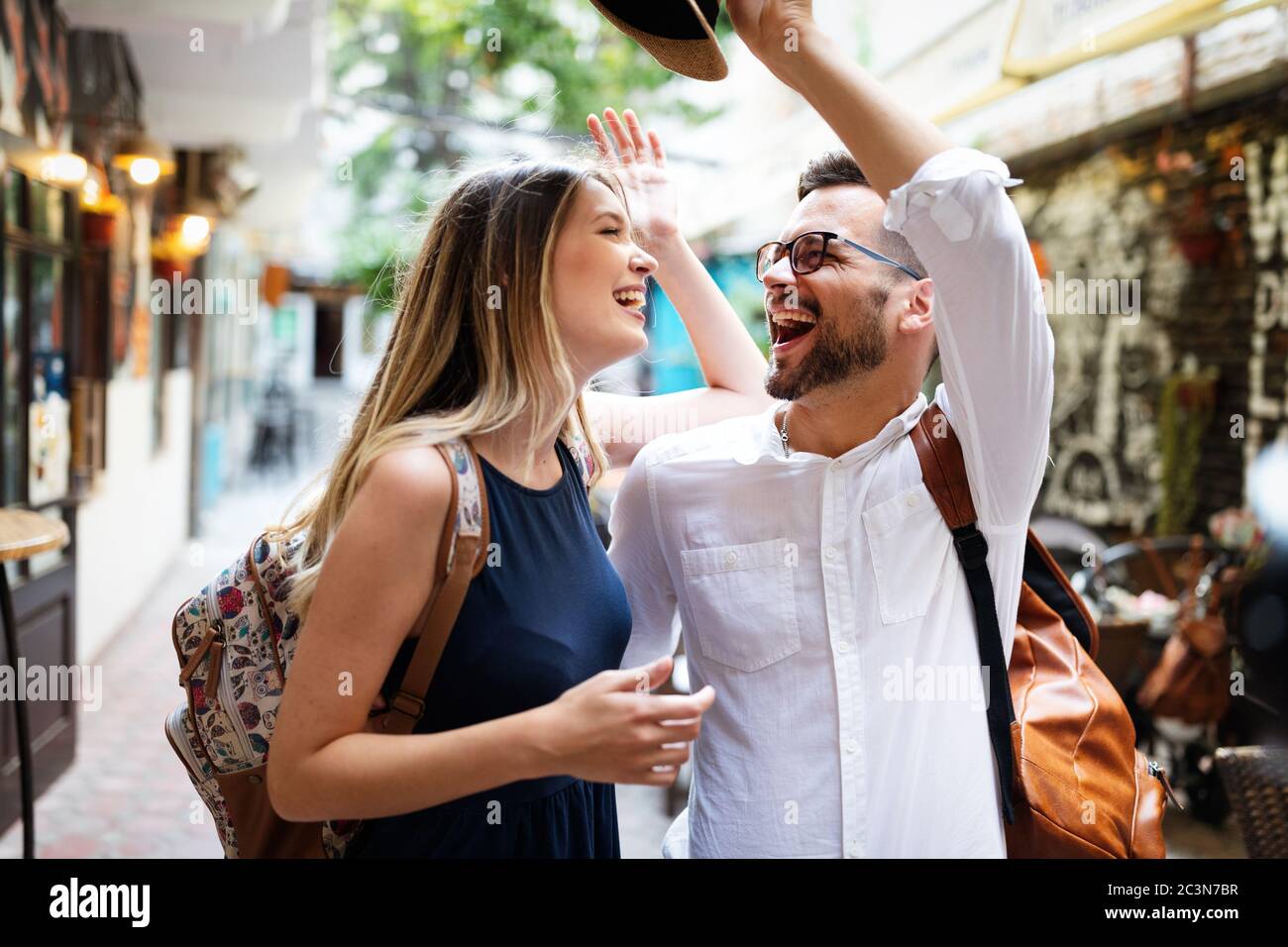 Happy tourist couple in love having fun, travel, smiling on vacation ...