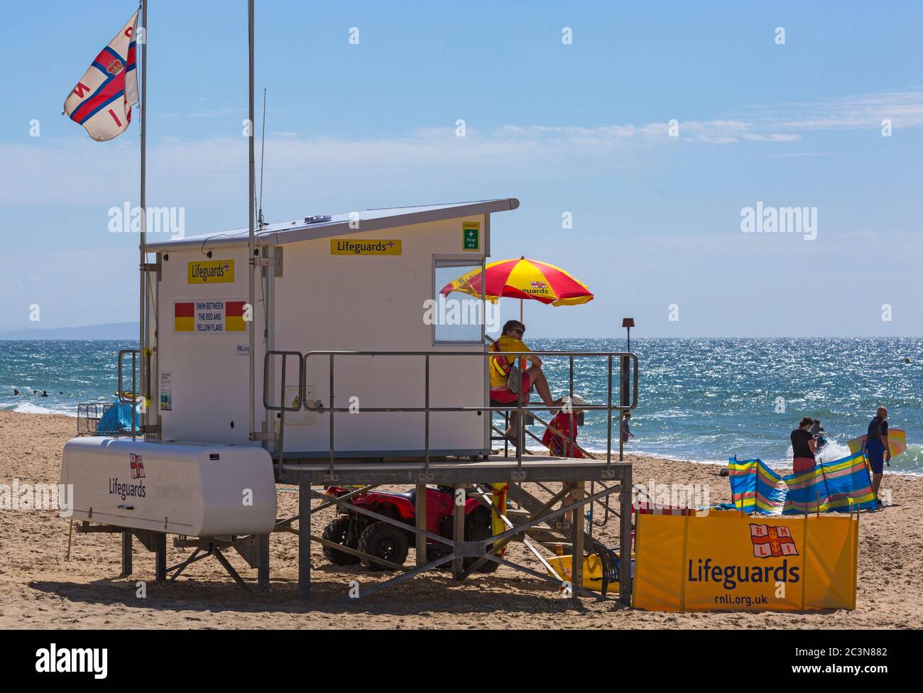 Lifeguard keeping a lookout lifeguard keeping a look out hi-res stock ...