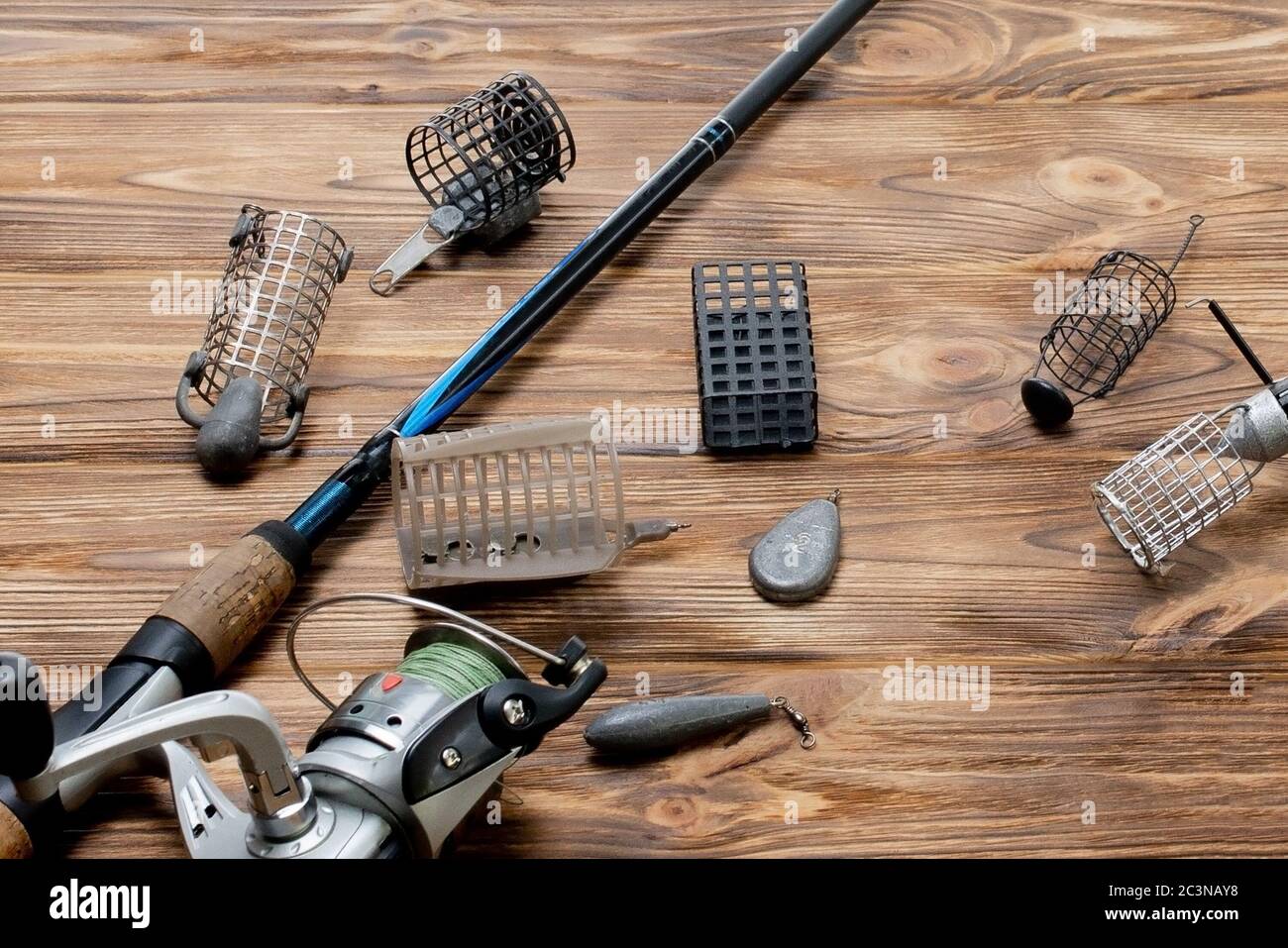 flat lay with fishing tackle, fishing rod and plastic box with fishing ...