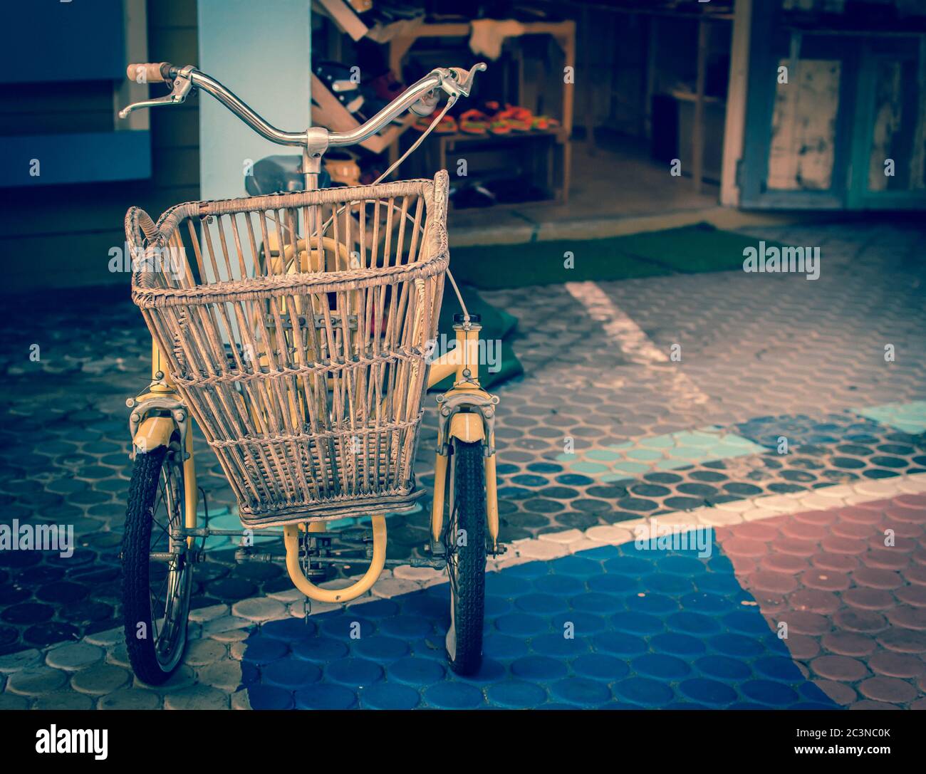 Old retro Mini bicycle with three wheels and basket Stock Photo - Alamy