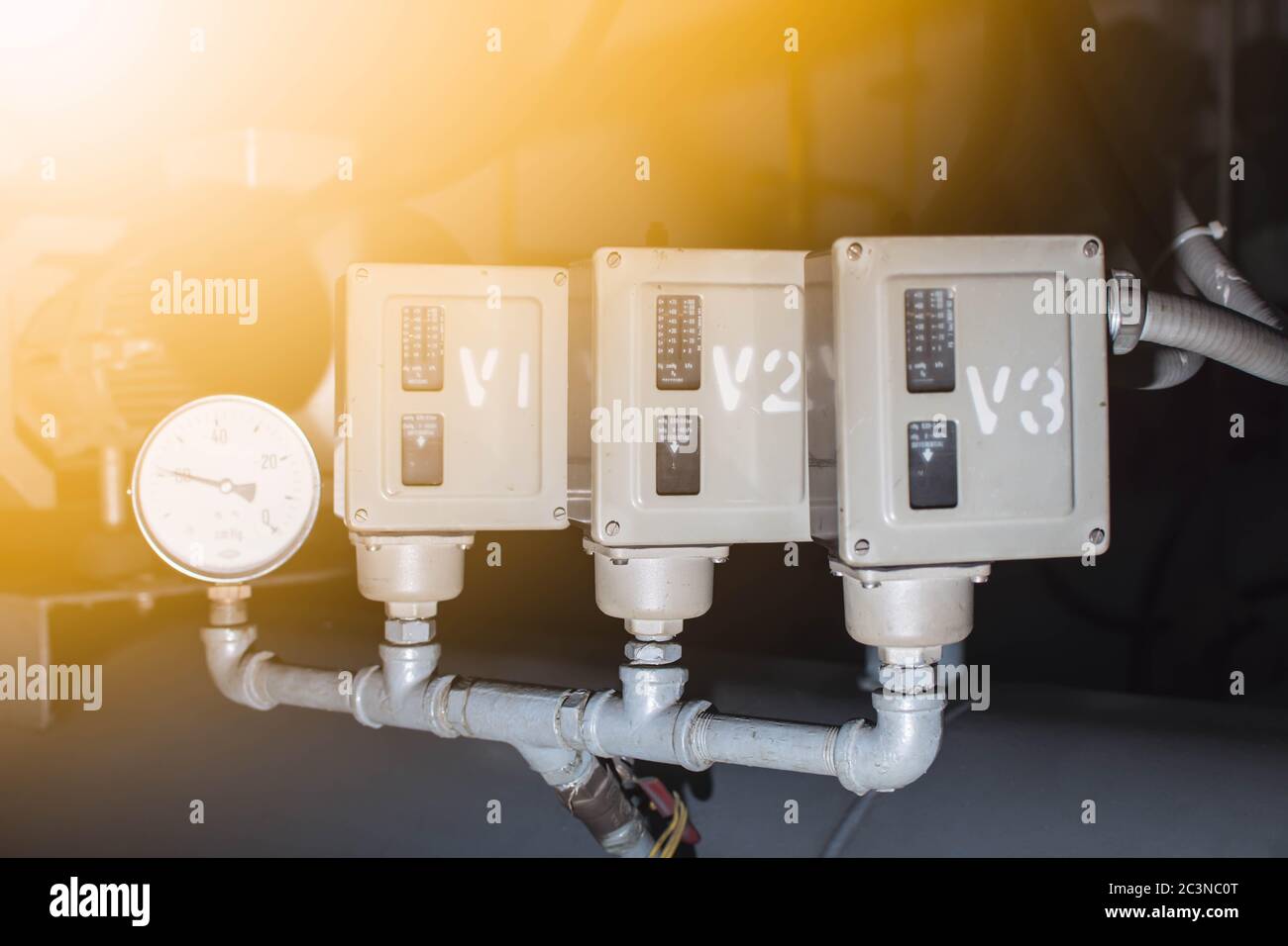 Closeup three meter and valves on pipes in industry Stock Photo - Alamy