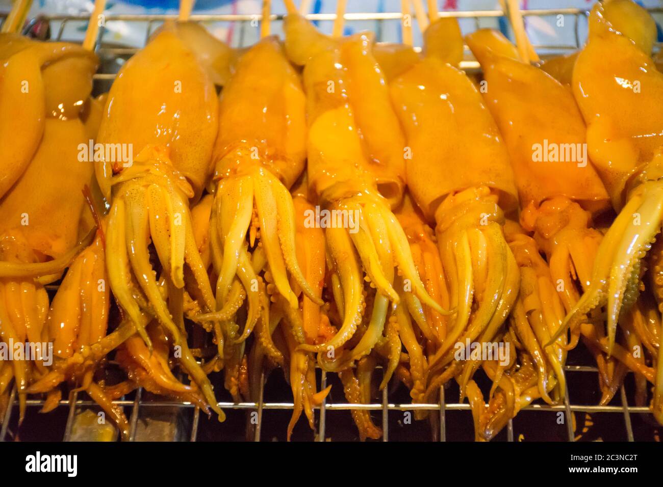 Street foods - Grilled squid Stock Photo - Alamy