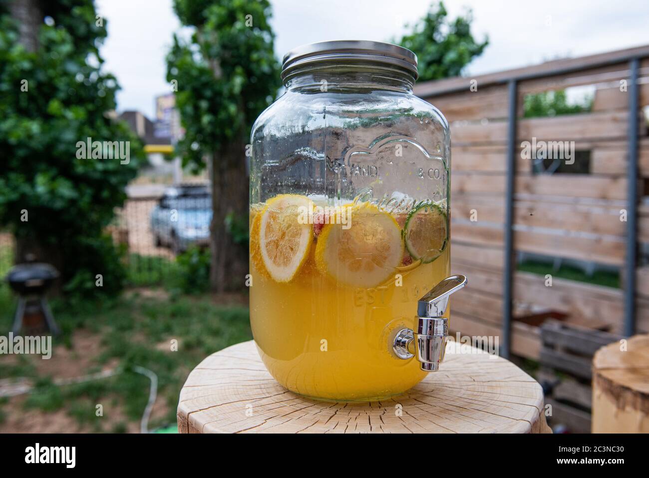 homemade lemonade with lemon and berries on a log Stock Photo - Alamy