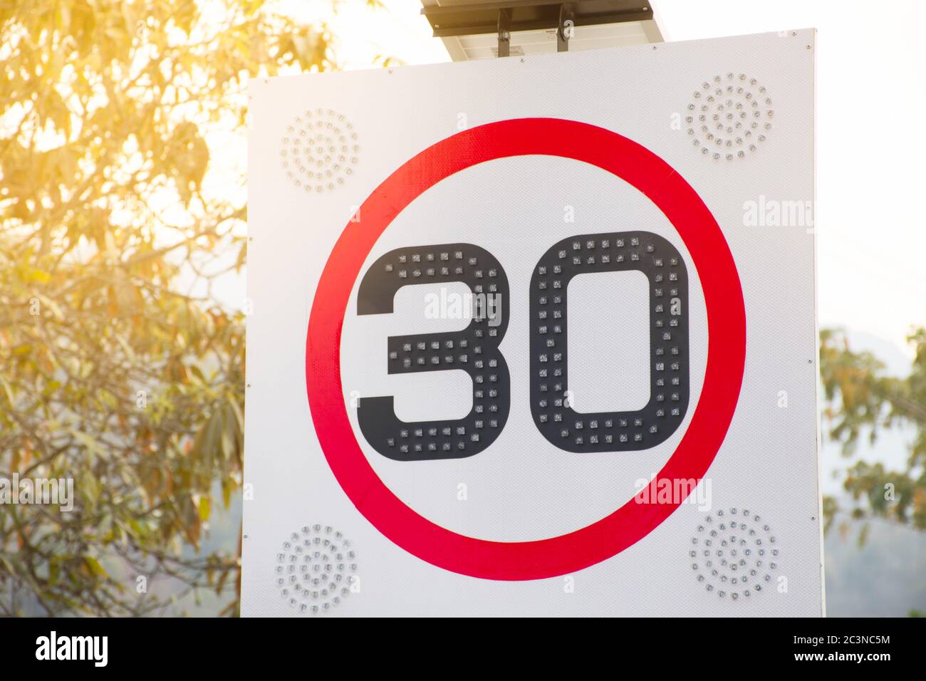 Round Red Road Sign: Speed limit 30 kilometers per hour Stock Photo - Alamy