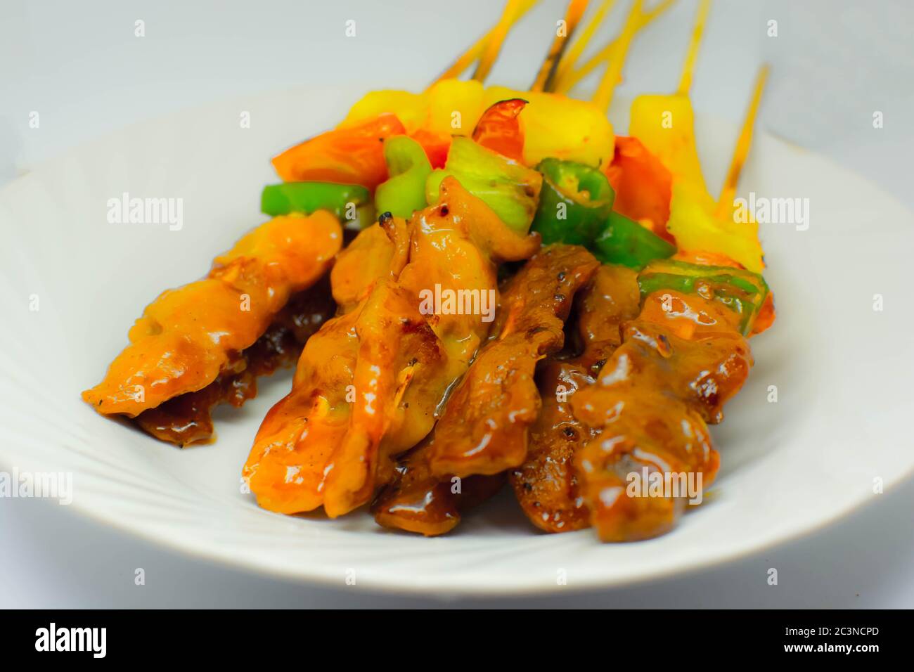 Skewer set of red meat and vegetables on white background Stock Photo ...