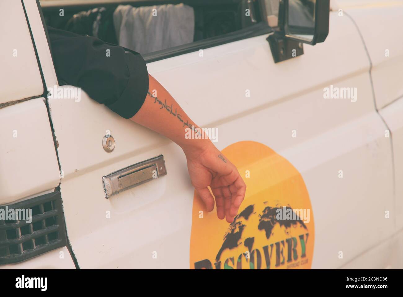 Shot of someone's hand hanging out of the car's window Stock Photo - Alamy