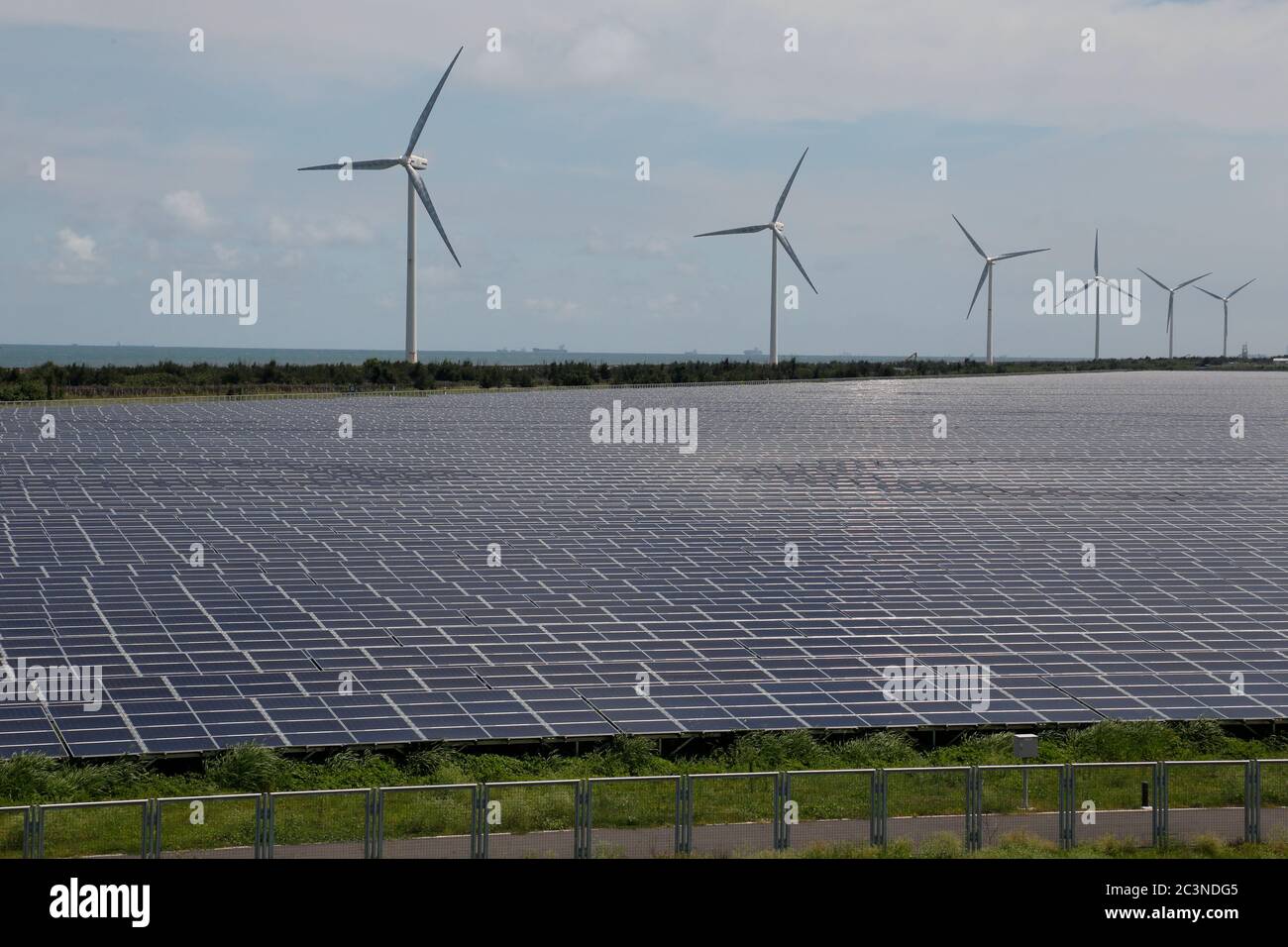 Windmill and solar power station Stock Photo - Alamy