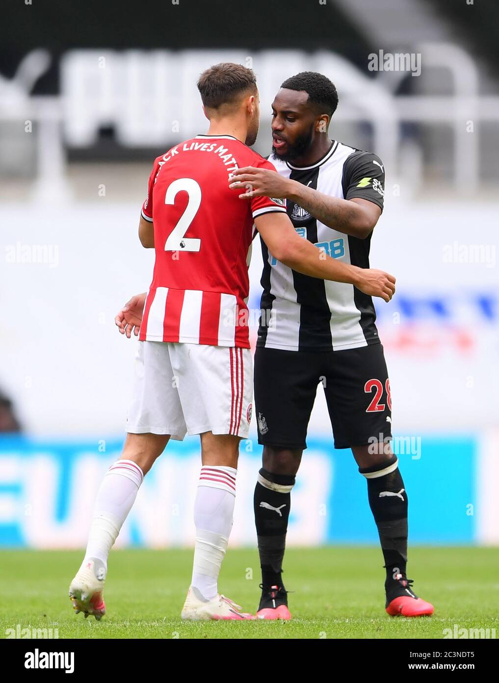 Newcastle United's Danny Rose embracres Sheffield United's George ...