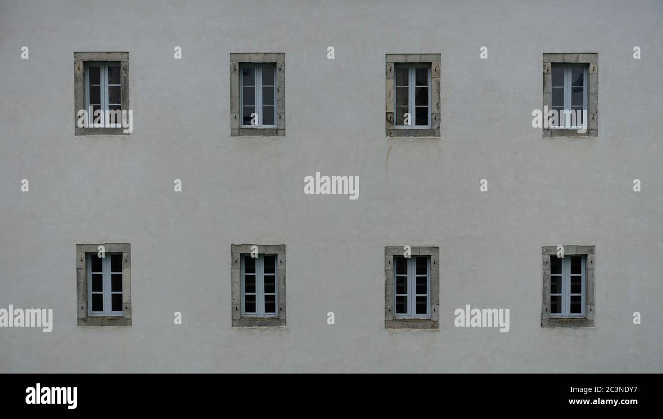 Windows of an old white residential building at daytime Stock Photo - Alamy